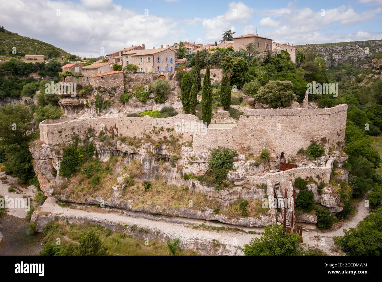 The medieval village Minerve and its scenic location on a steep cliff ...