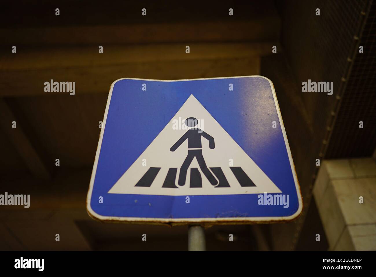 A closeup of a pedestrian crossing road sign on the metal post Stock ...