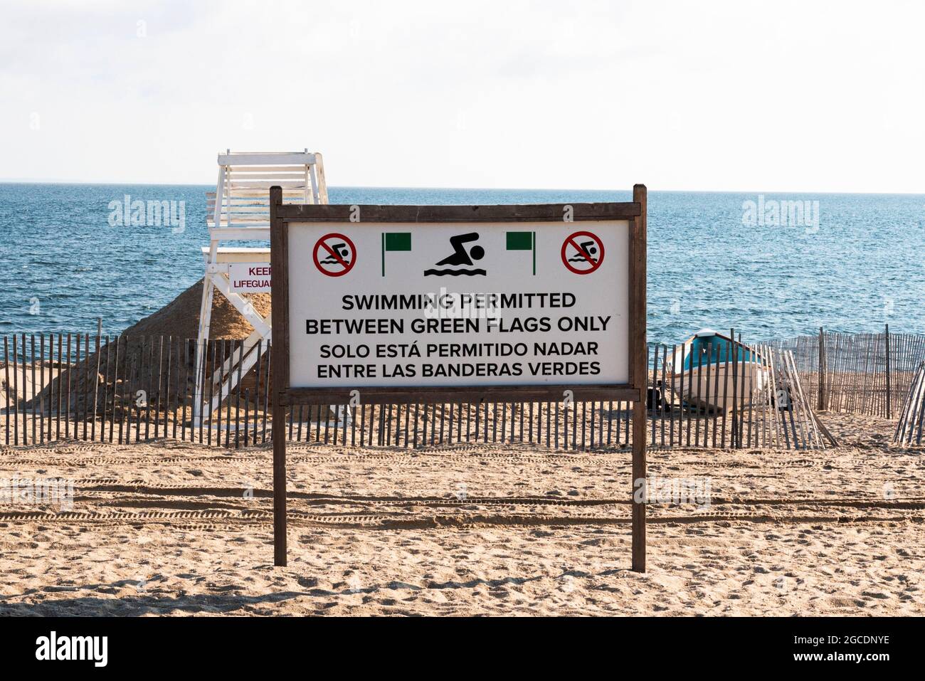 Swimming permitted between green flags only on a beach with a life ...