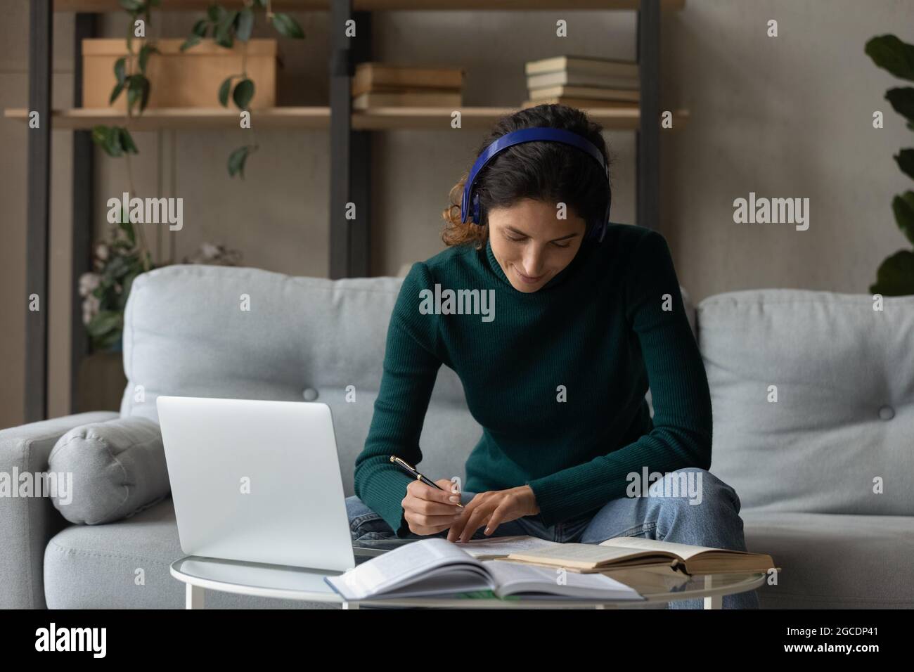 Woman taking notes in class hi-res stock photography and images - Alamy