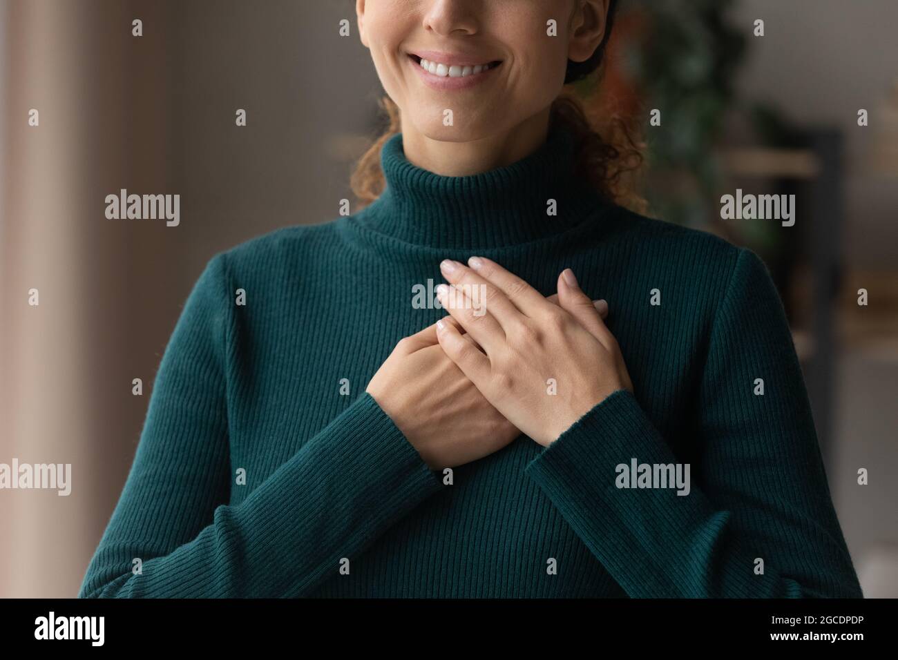 Hands folded to chest High Resolution Stock Photography and Images - Alamy