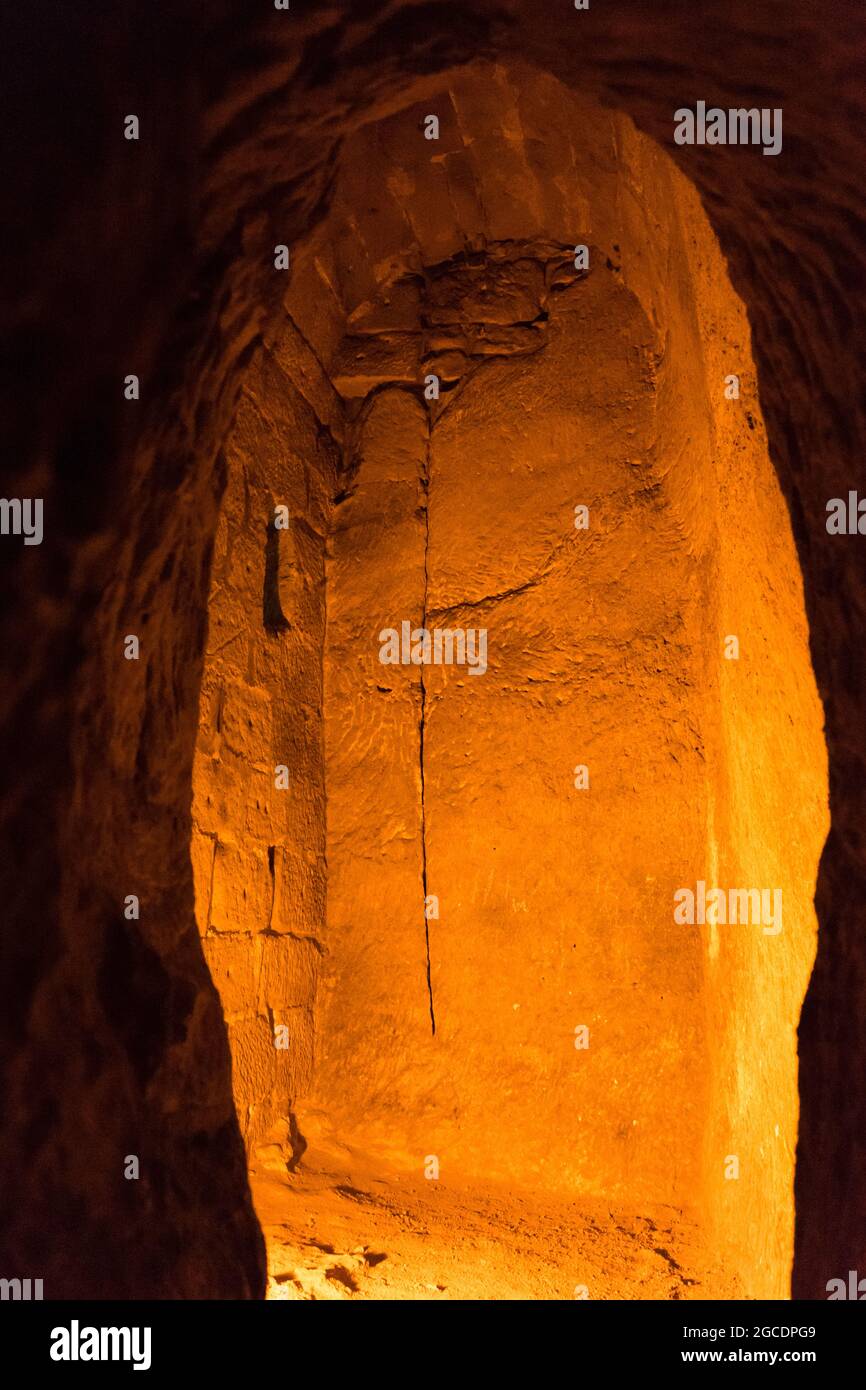 ancient vault of a medieval castle rough stone texture and orange light ...