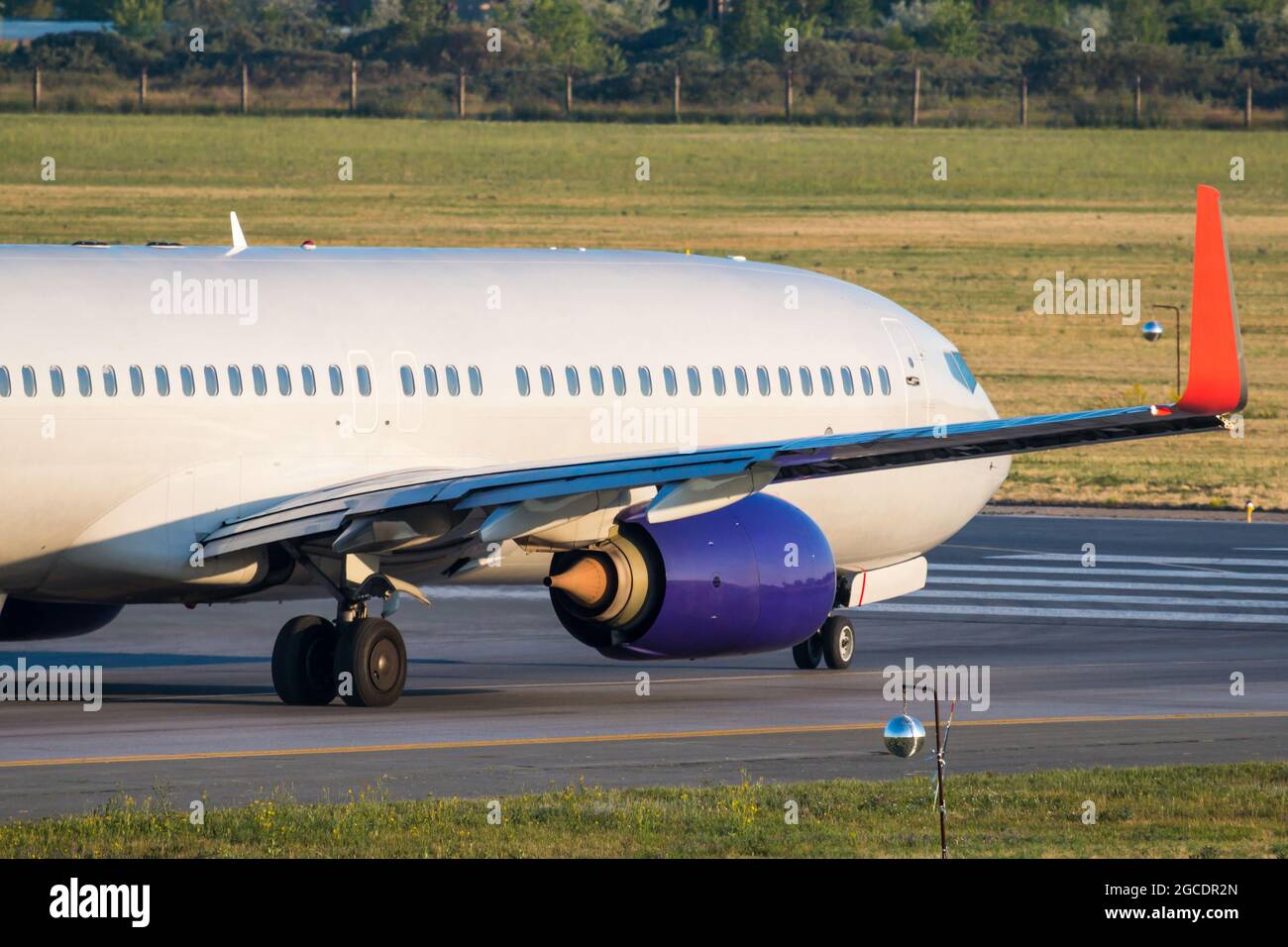 Close-up view taxiing of a passenger airliner on the runway Stock Photo ...