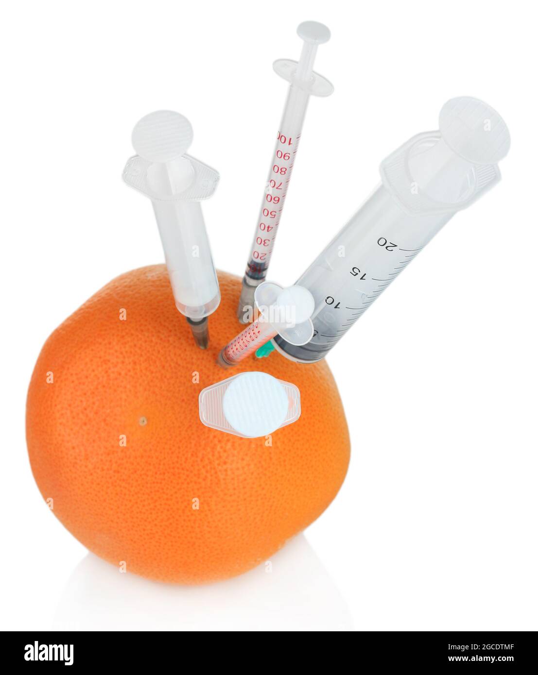 Injection into fresh grapefruit isolated on white Stock Photo - Alamy