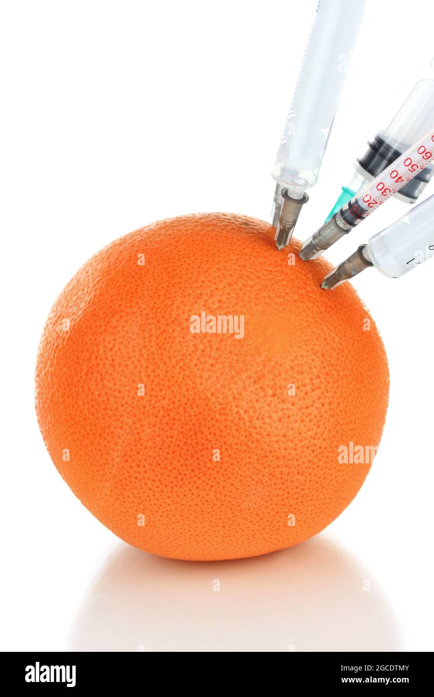 Injection into fresh grapefruit isolated on white Stock Photo - Alamy