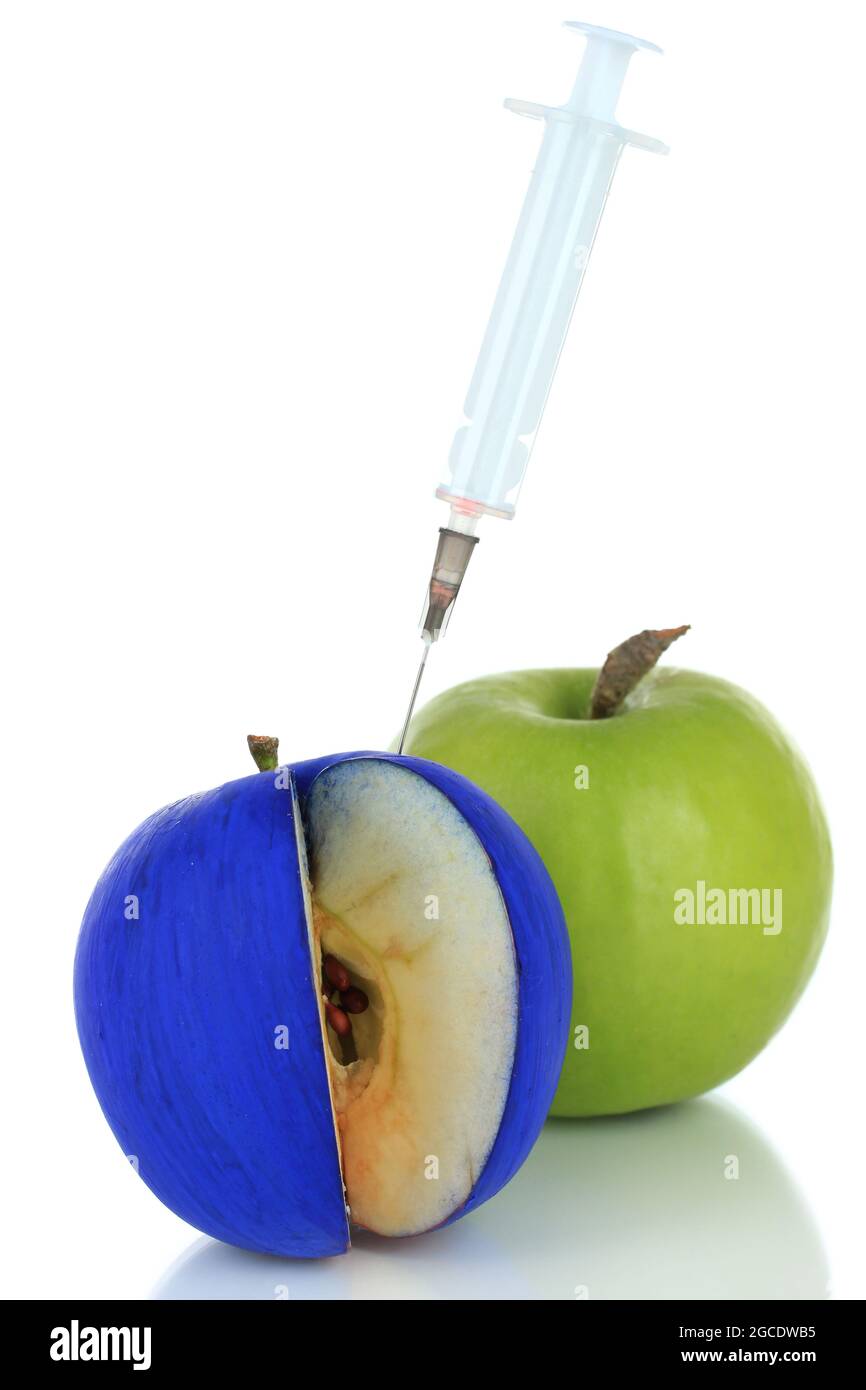 Injection into apple isolated on white Stock Photo - Alamy