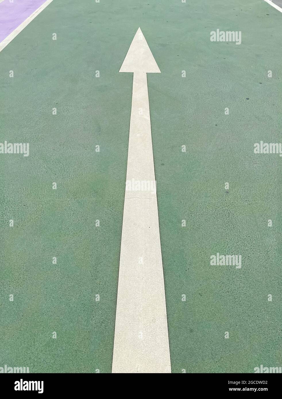 Simple straightforward solution concept: White isolated arrow on green ...