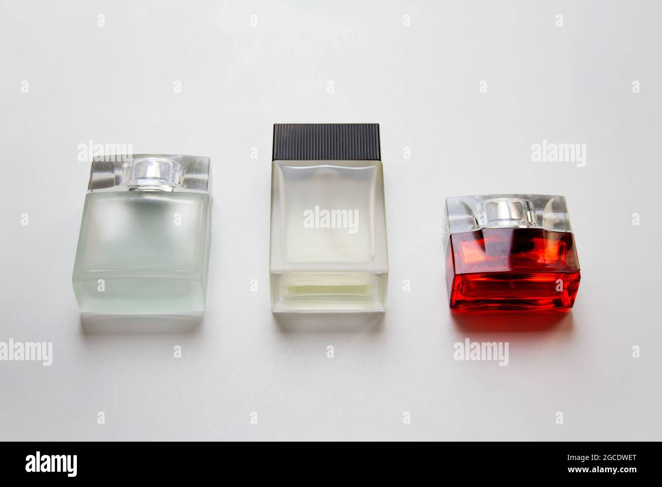 Three rectangular glass perfume bottles isolated on white background ...