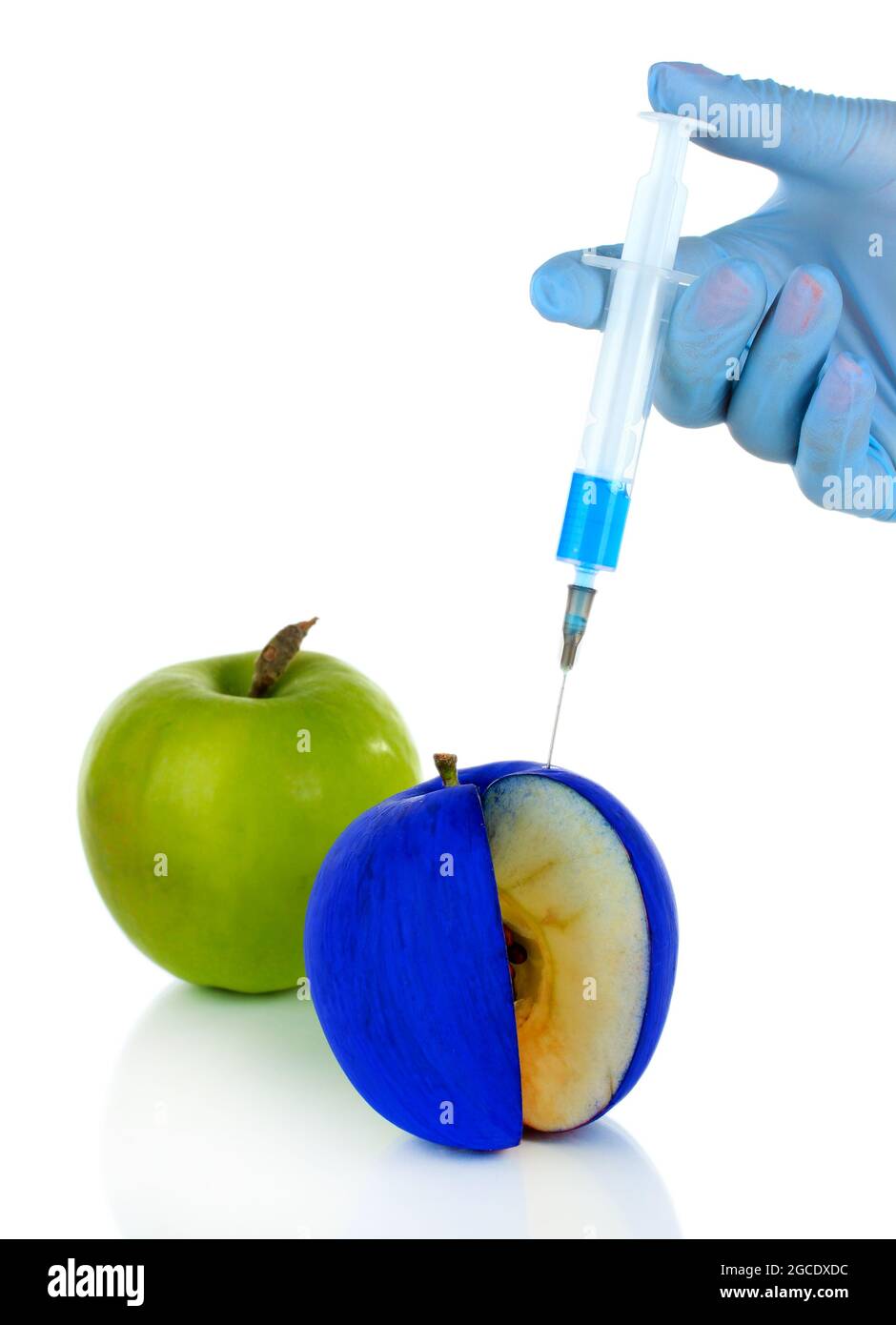 Injection into apple isolated on white Stock Photo - Alamy