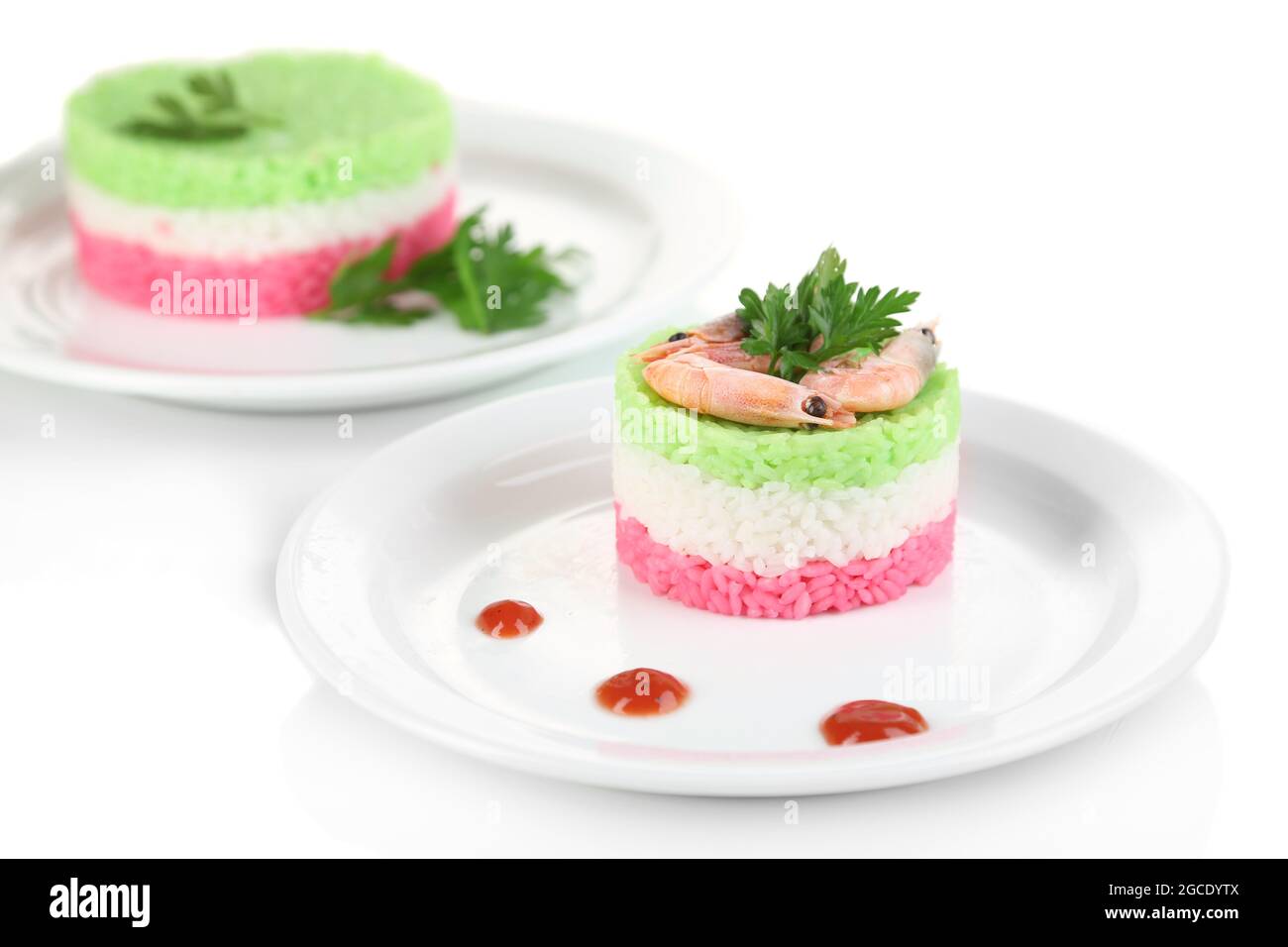Colored rice on plates isolated on white Stock Photo - Alamy
