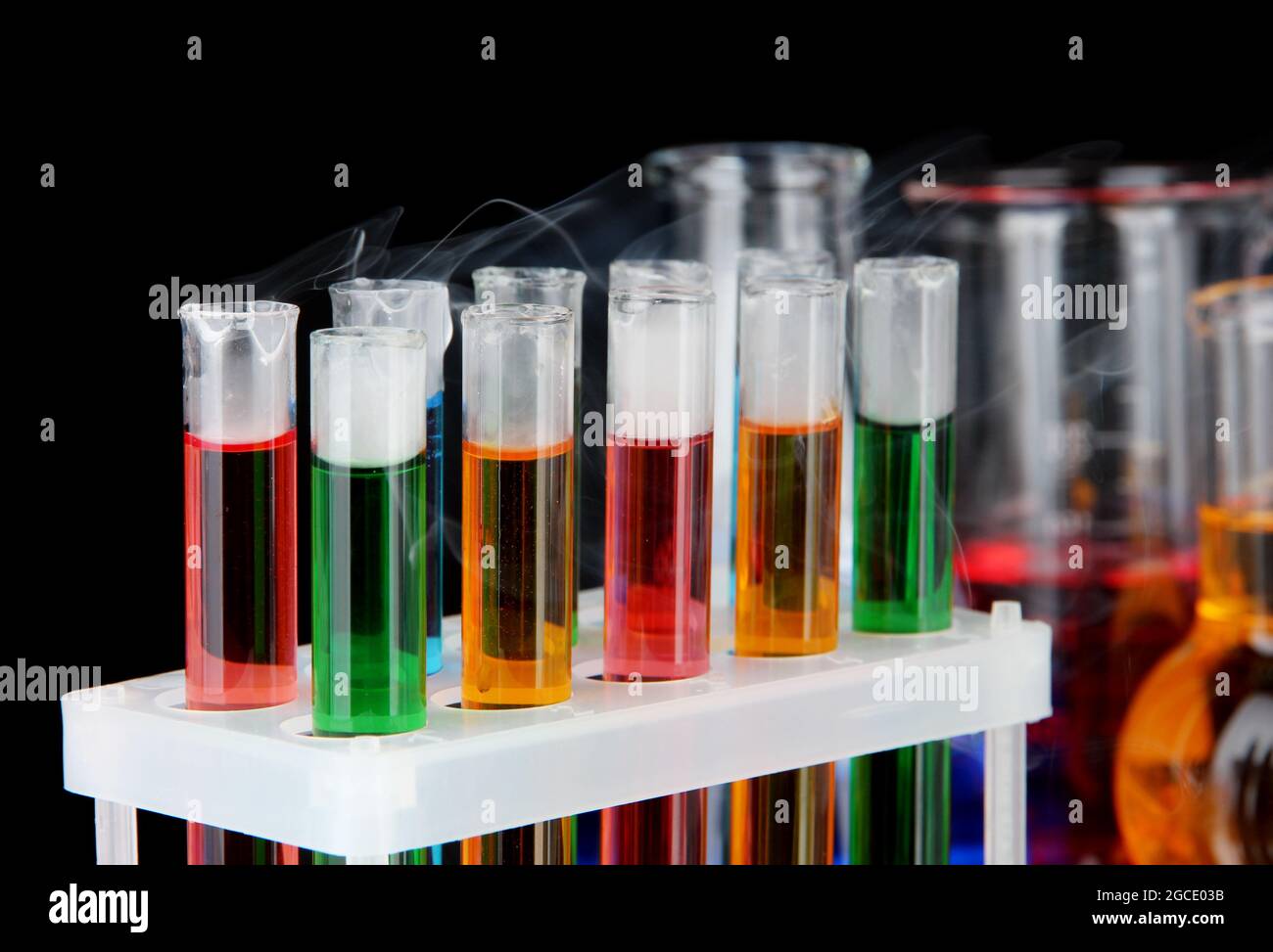 Laboratory test tubes on black background Stock Photo - Alamy