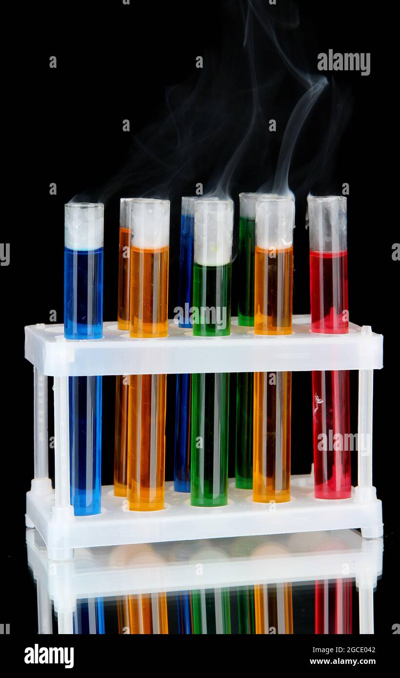 Laboratory test tubes on black background Stock Photo - Alamy