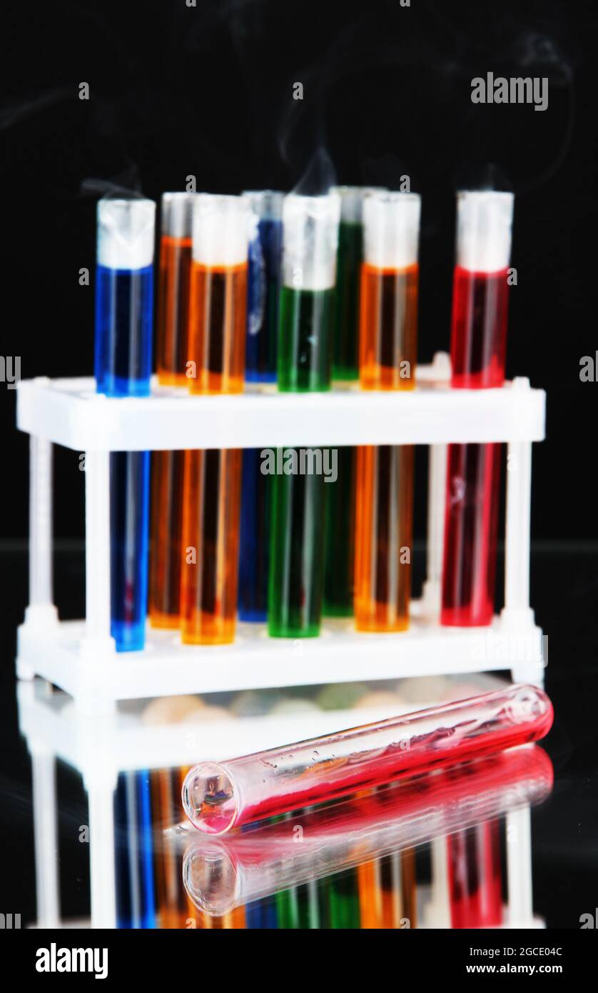 Laboratory test tubes on black background Stock Photo - Alamy