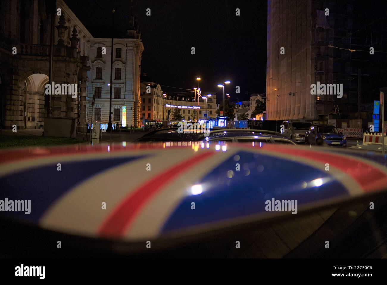 A beautiful night view of the city with the blurred flag of the UK ...