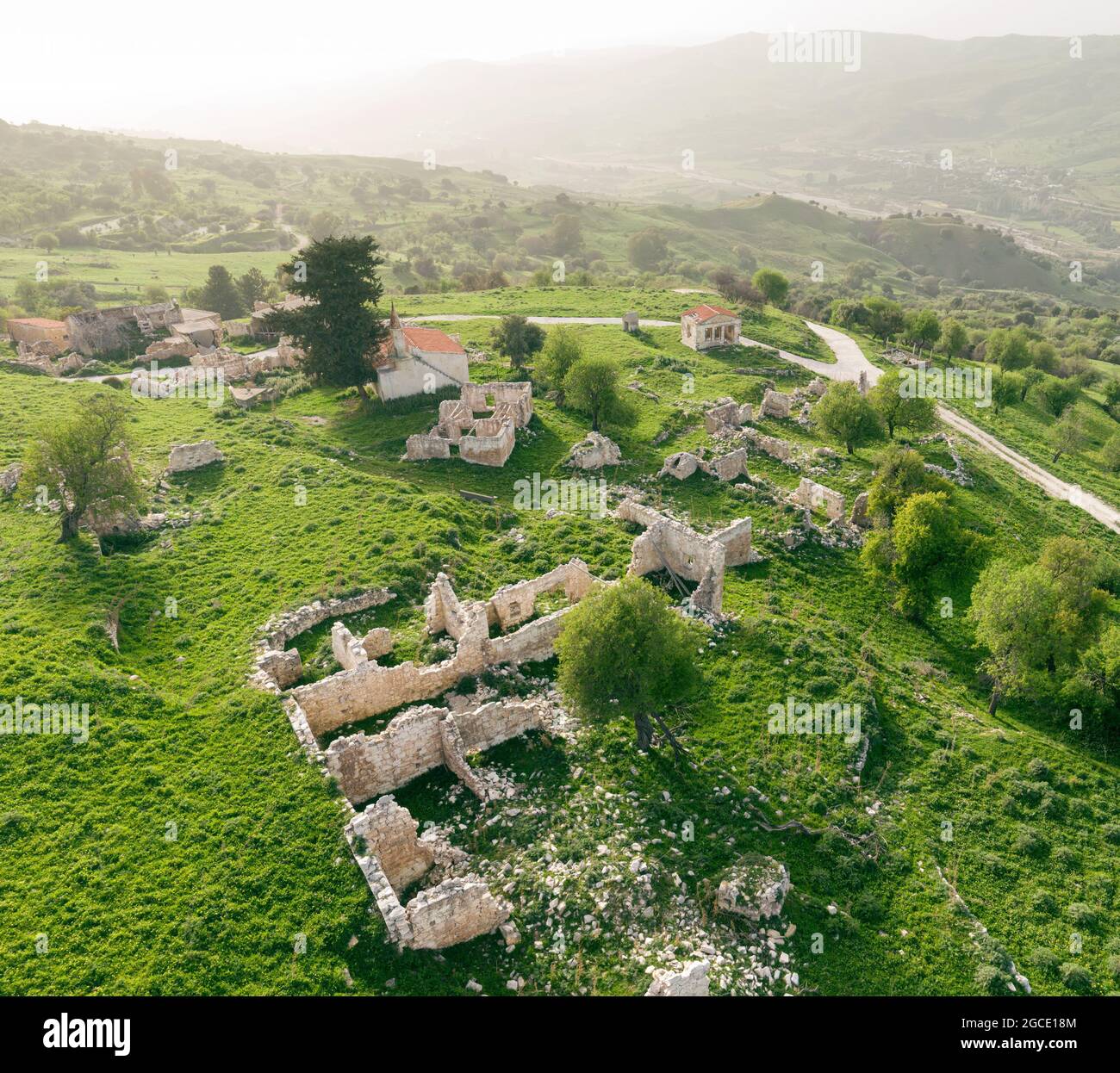 Aerial landscape, old abandoned village with stone buildings in ruins ...