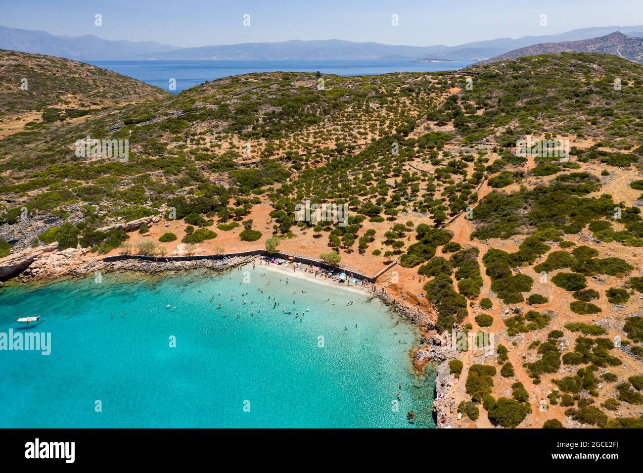 Aerial view of a crystal clear blue ocean and hot, summer landscape ...