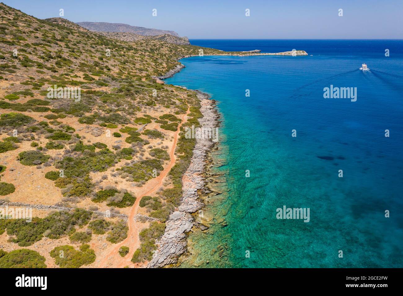 Aerial view of a crystal clear blue ocean and hot, summer landscape ...