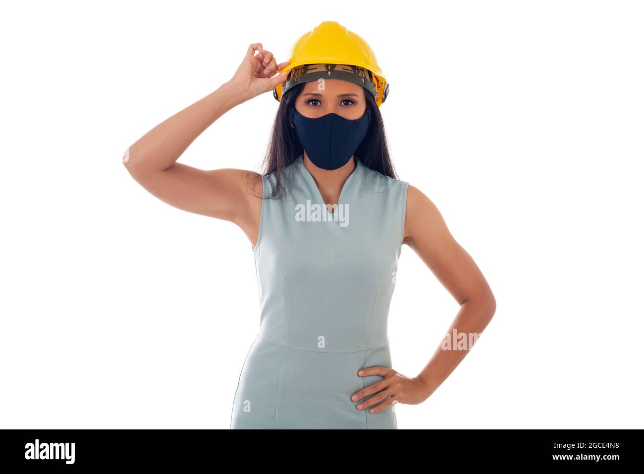 portrait of asian engineer woman with helmet wearing a face mask ...