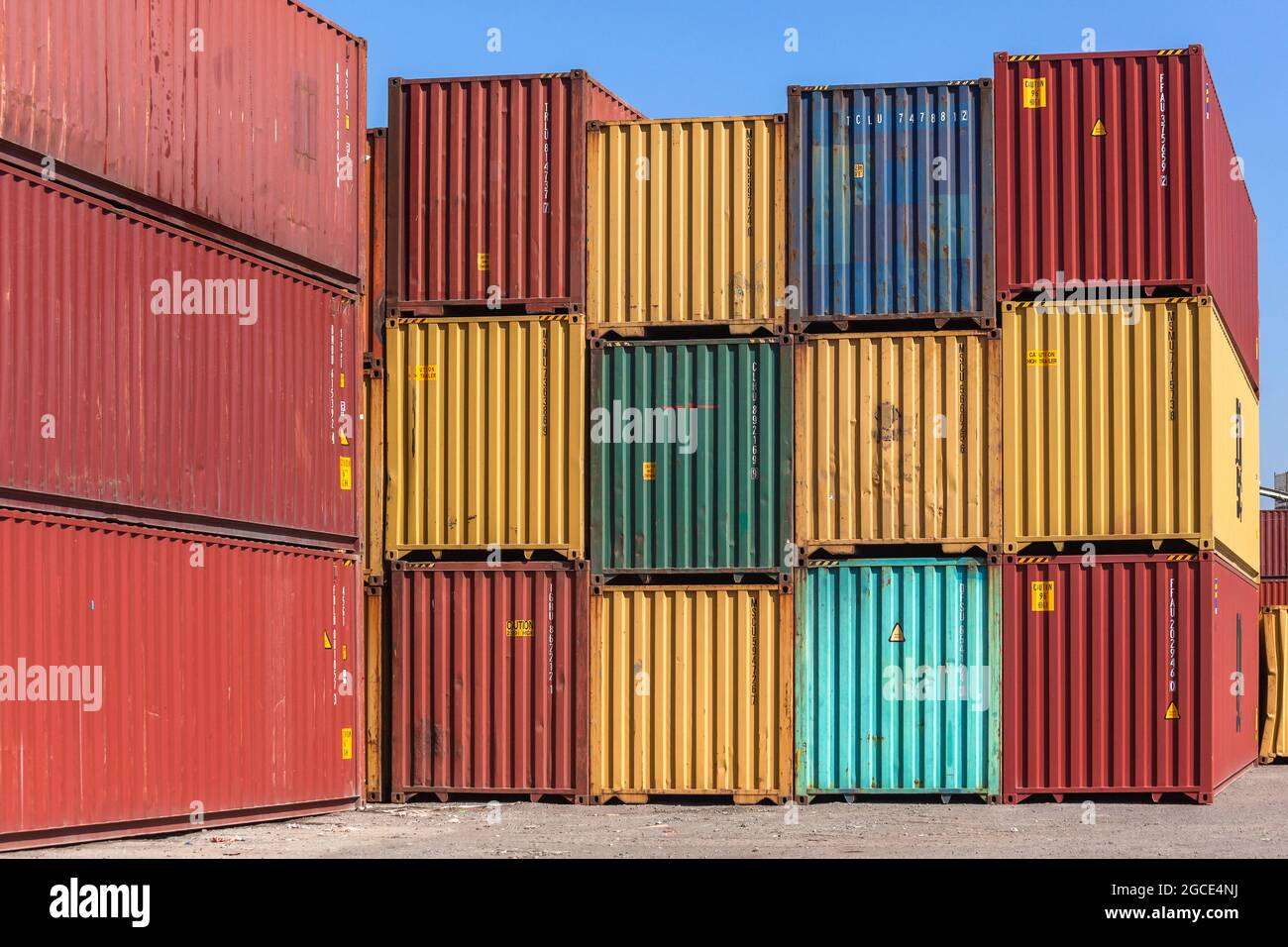 Steel Shipping cargo containers stacked high in yard depot Stock Photo ...