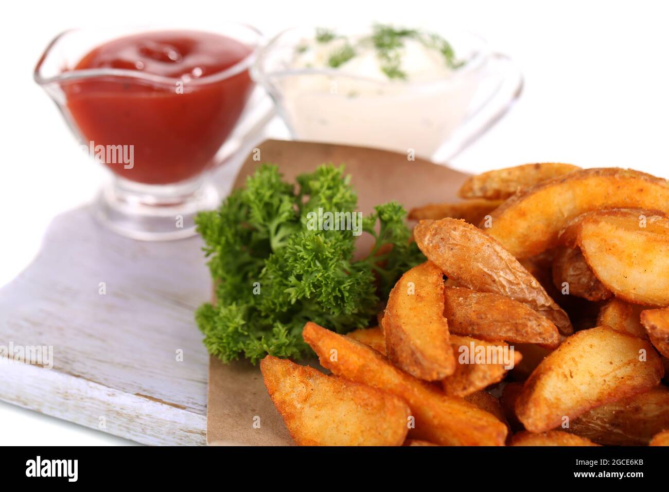 Home potatoes on tracing paper on wooden board isolated on white Stock ...