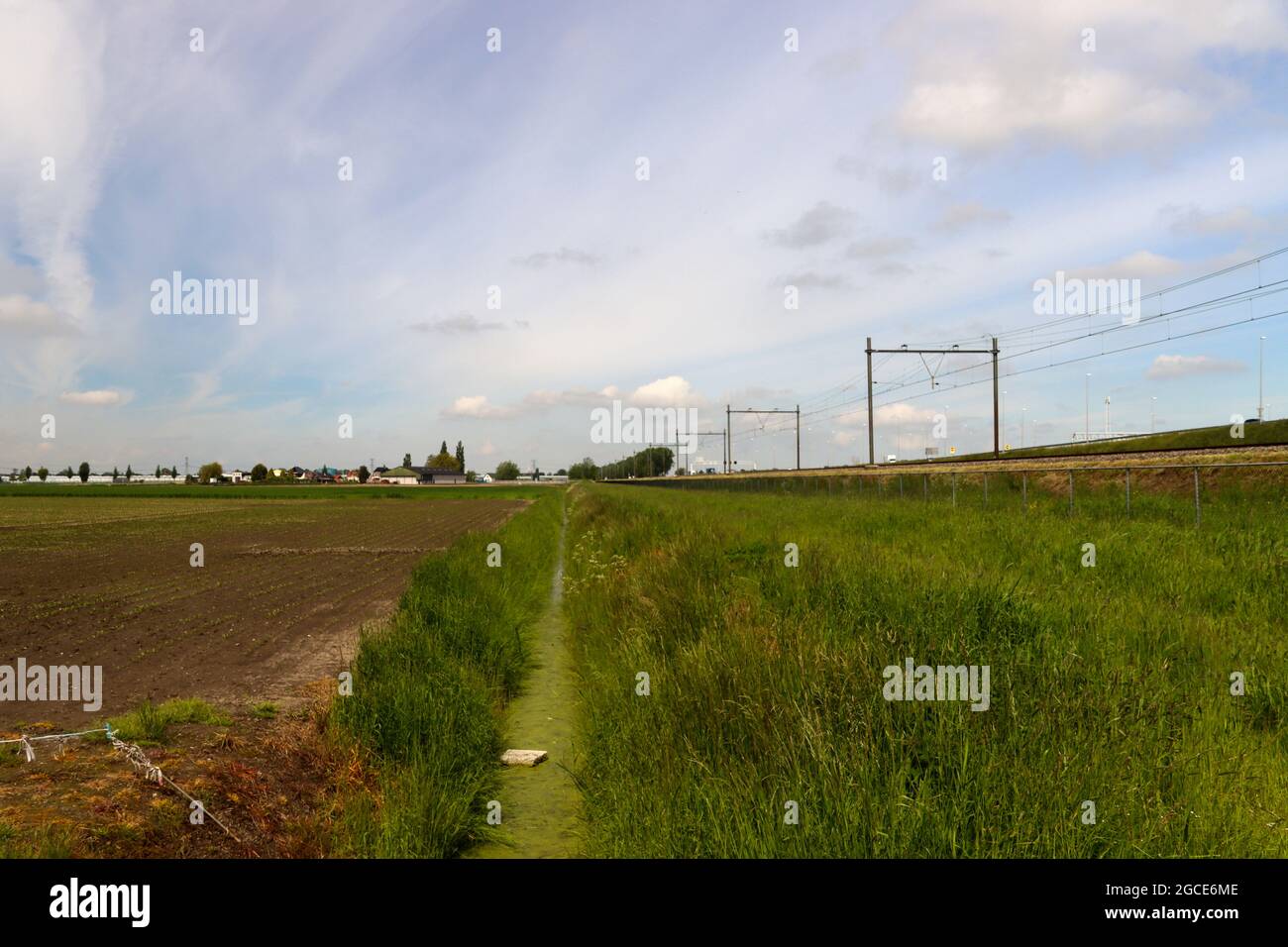Railroad track along meadows in the Zuidplaspolder in the Netherlands ...