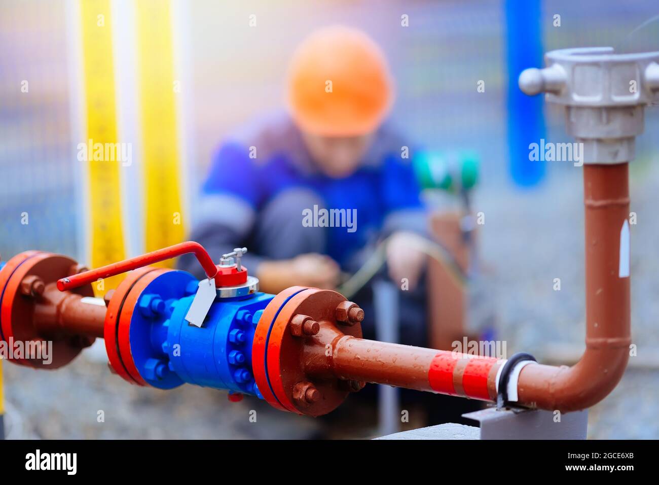 Crane connection of pipe for gasification. The specialist inspects and ...