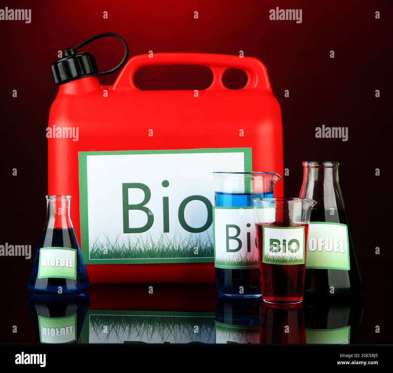 Bio fuels in canister and vials on red background Stock Photo - Alamy