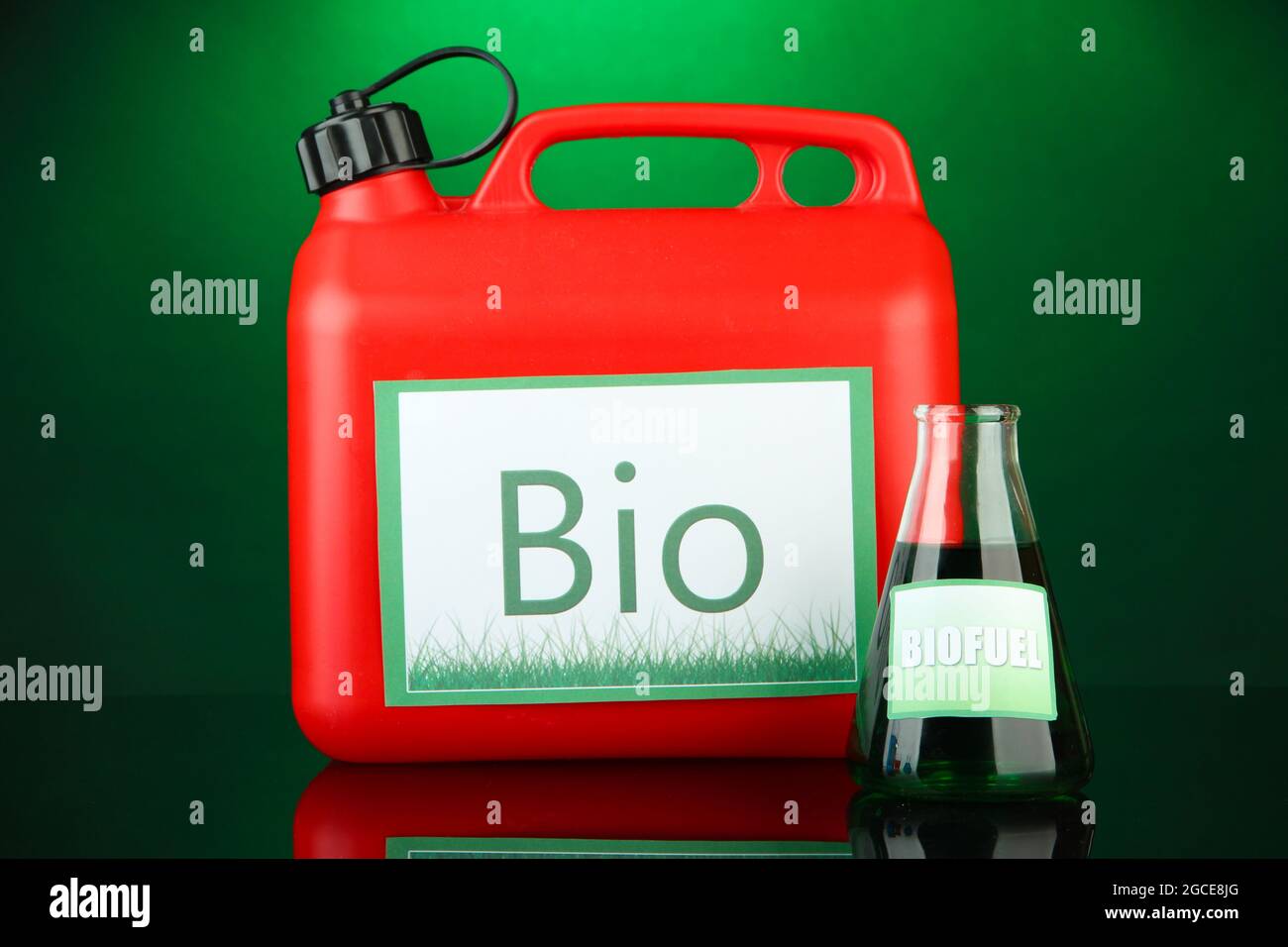Bio fuels in canister and vials on green background Stock Photo - Alamy