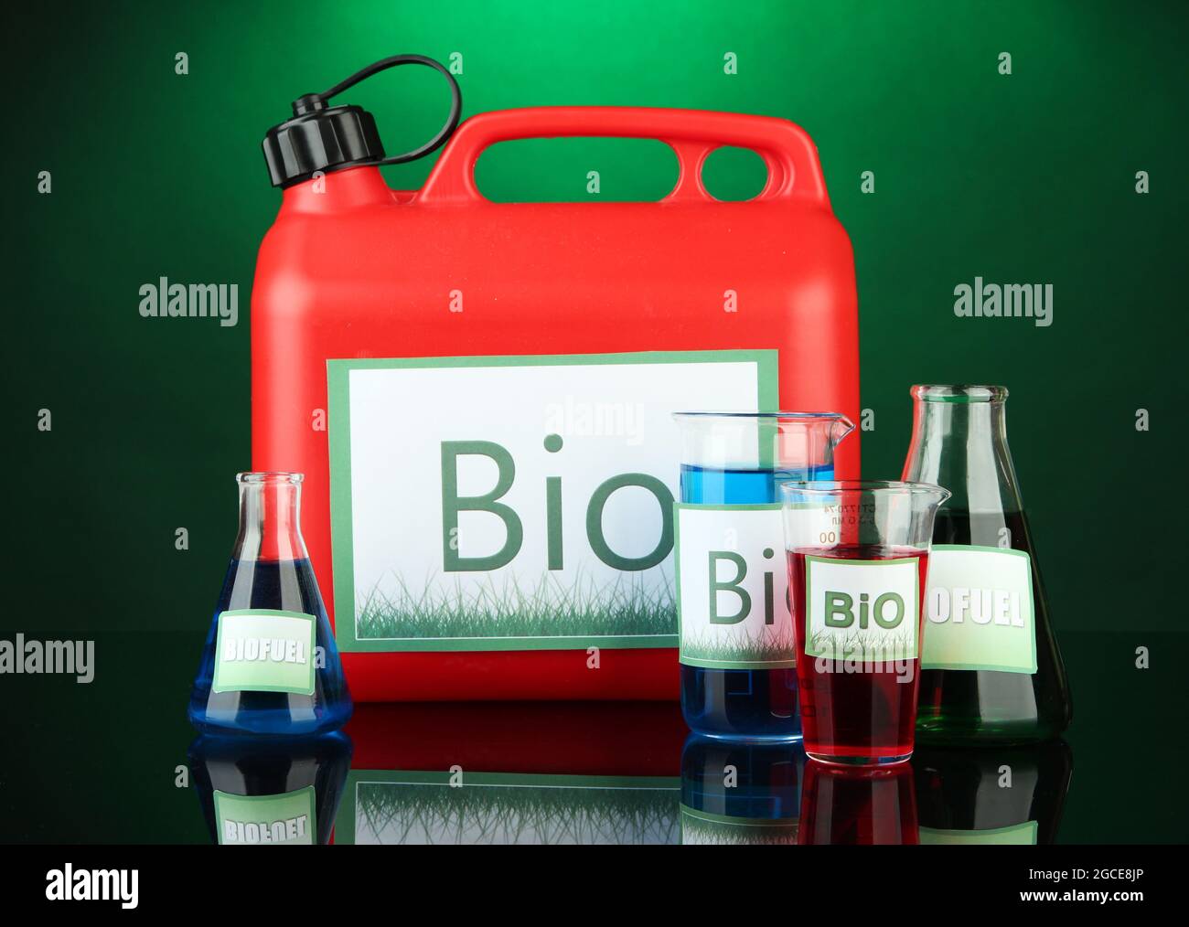 Bio fuels in canister and vials on green background Stock Photo - Alamy