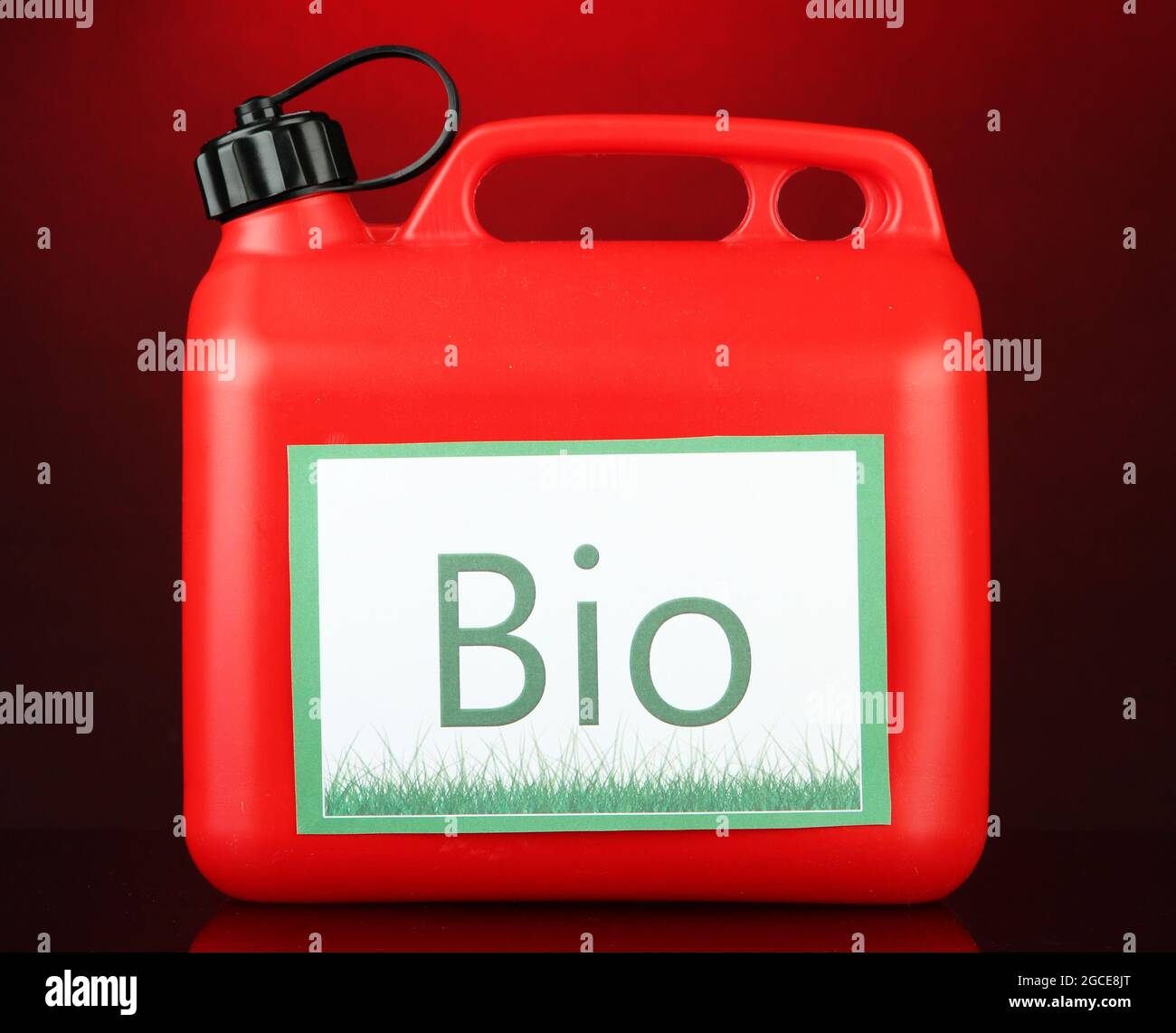Bio fuels in canister on red background Stock Photo - Alamy