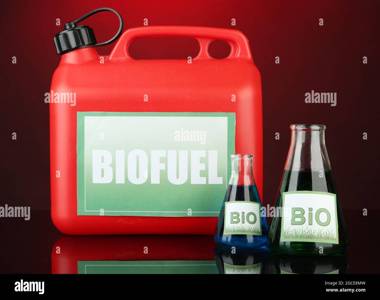 Bio fuels in canister and vials on red background Stock Photo - Alamy