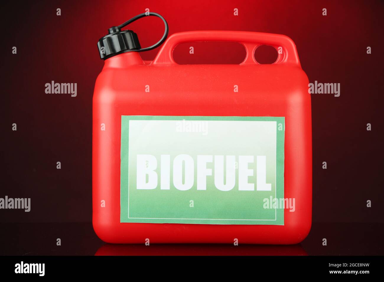 Bio fuels in canister on red background Stock Photo - Alamy