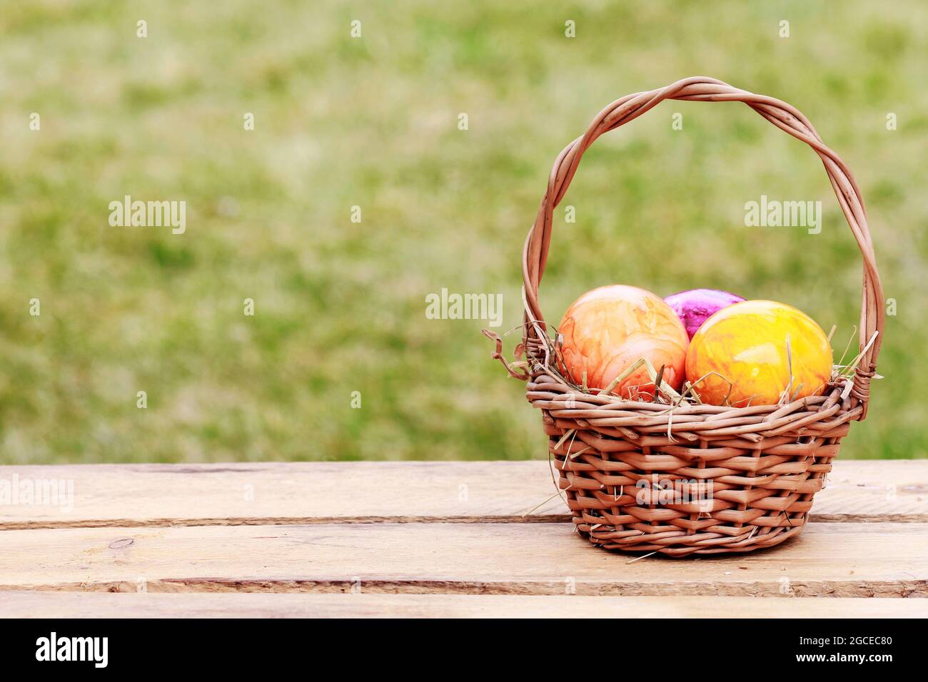 Traditional Easter basket with colorful eggs. Festive decor Stock Photo ...