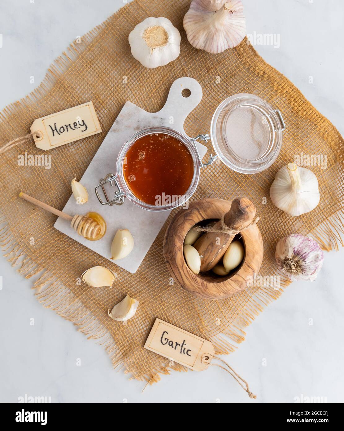Top down view of honey garlic ingredients on a piece of rustic burlap ...