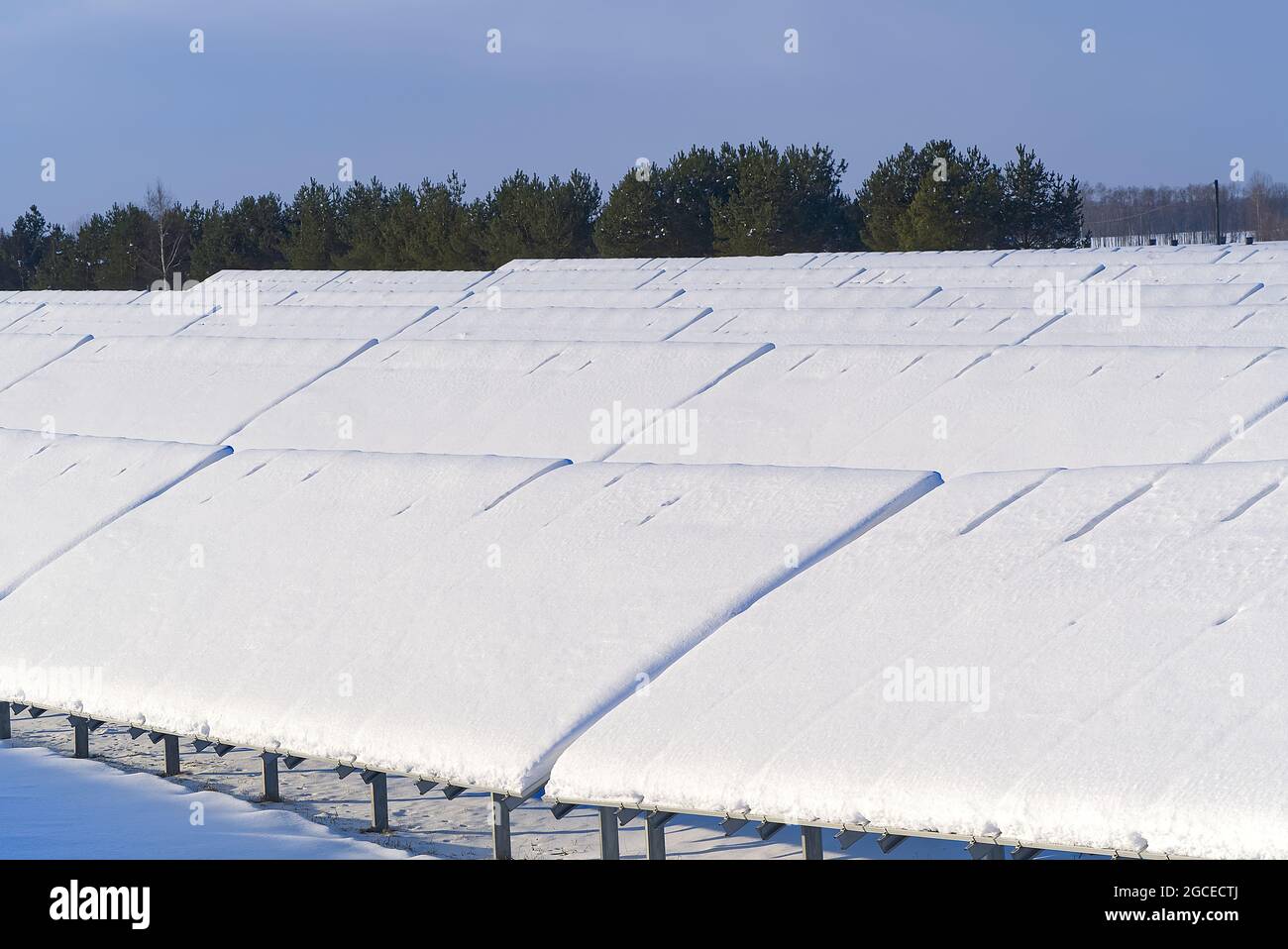 Solar panel field covered with snow. renewable energy in winter low ...