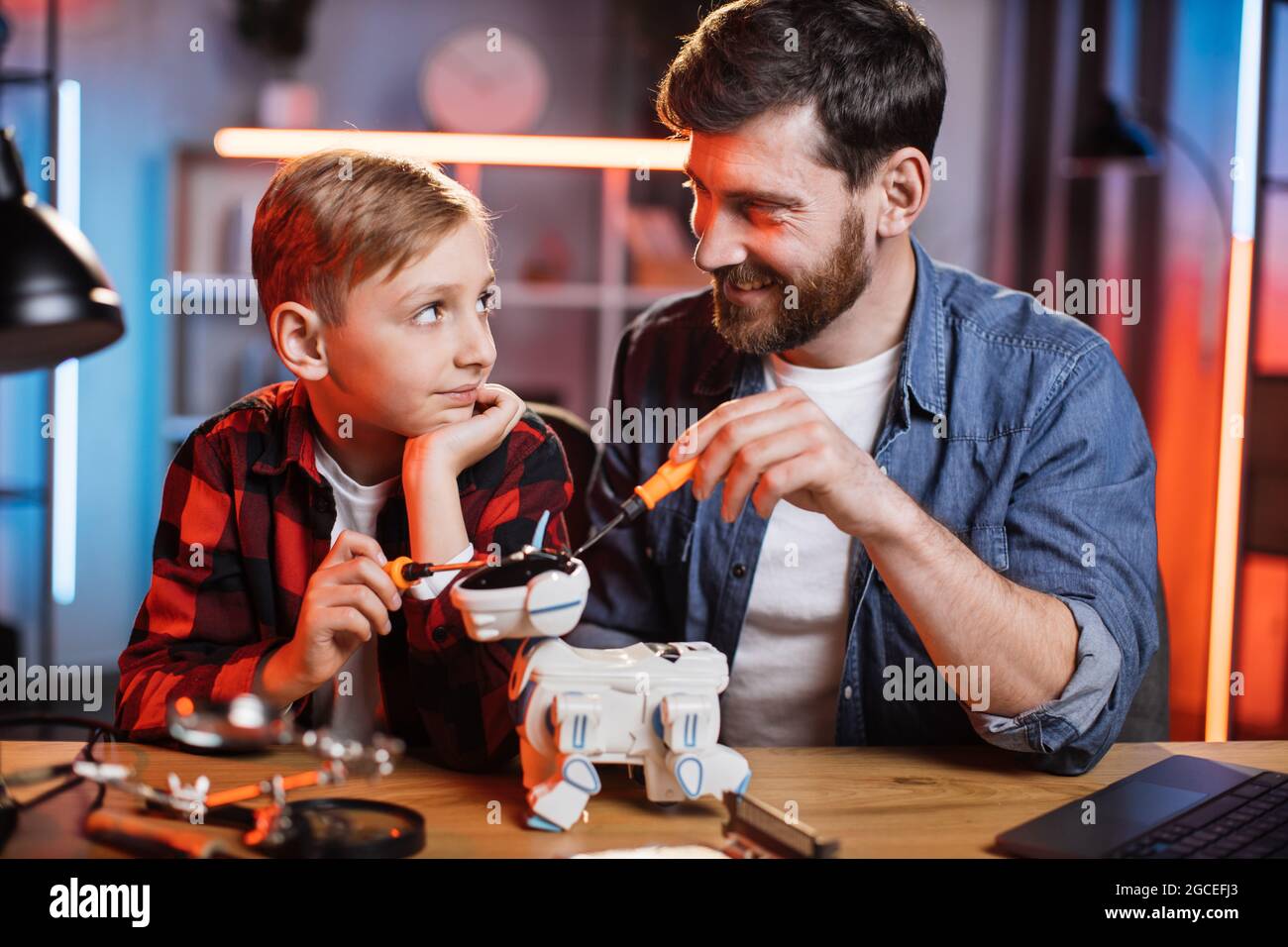 Father son robot toy together hi-res stock photography and images - Alamy