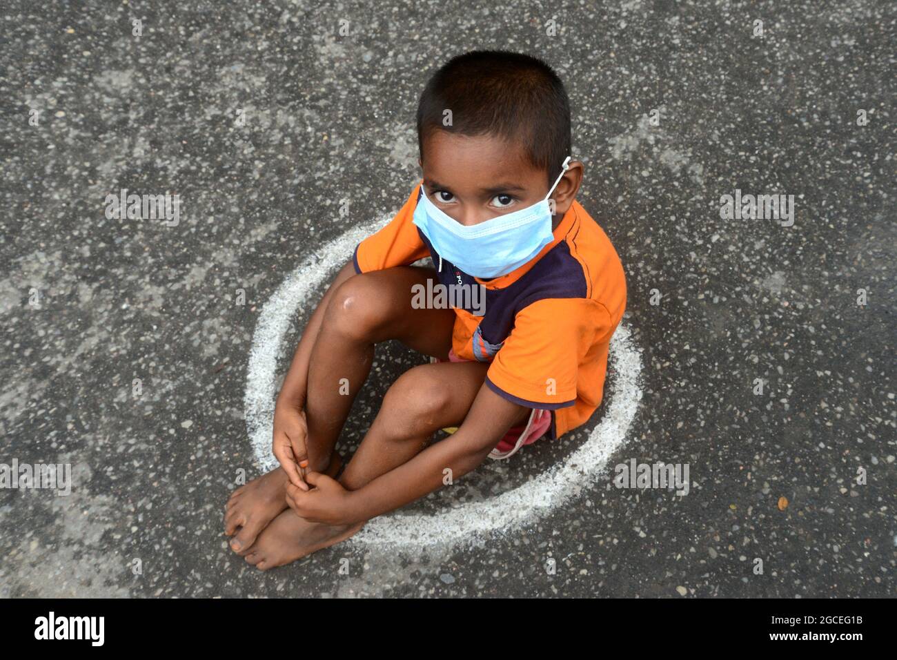 Poor people queue sit waits for receive food from Dhaka Metropolitan ...