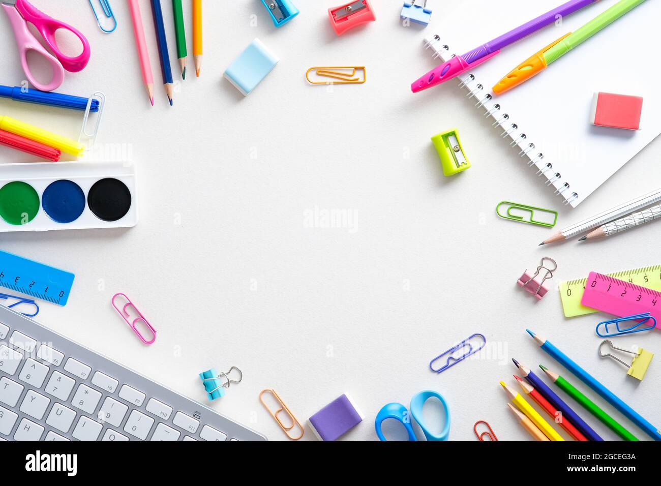 Flat lay colorful school supplies on white background. Back to school ...