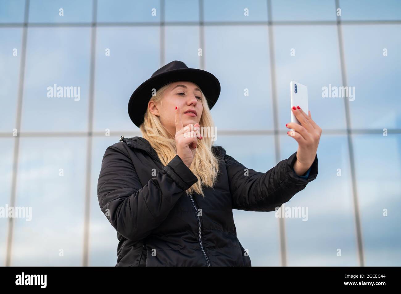 Deaf-mute young woman and speaks sign language over video communication ...