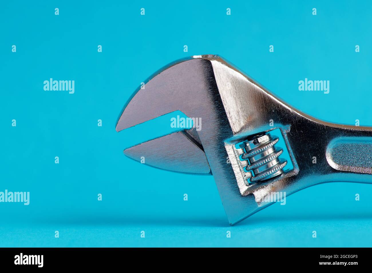 close up of adjustable wrench in blue background Stock Photo - Alamy