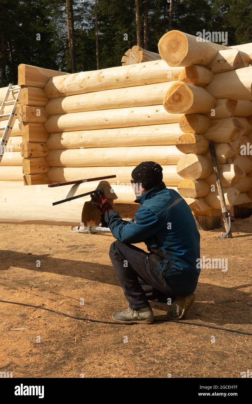 Build a house from logs. Preparation of logs for the assembly of the ...