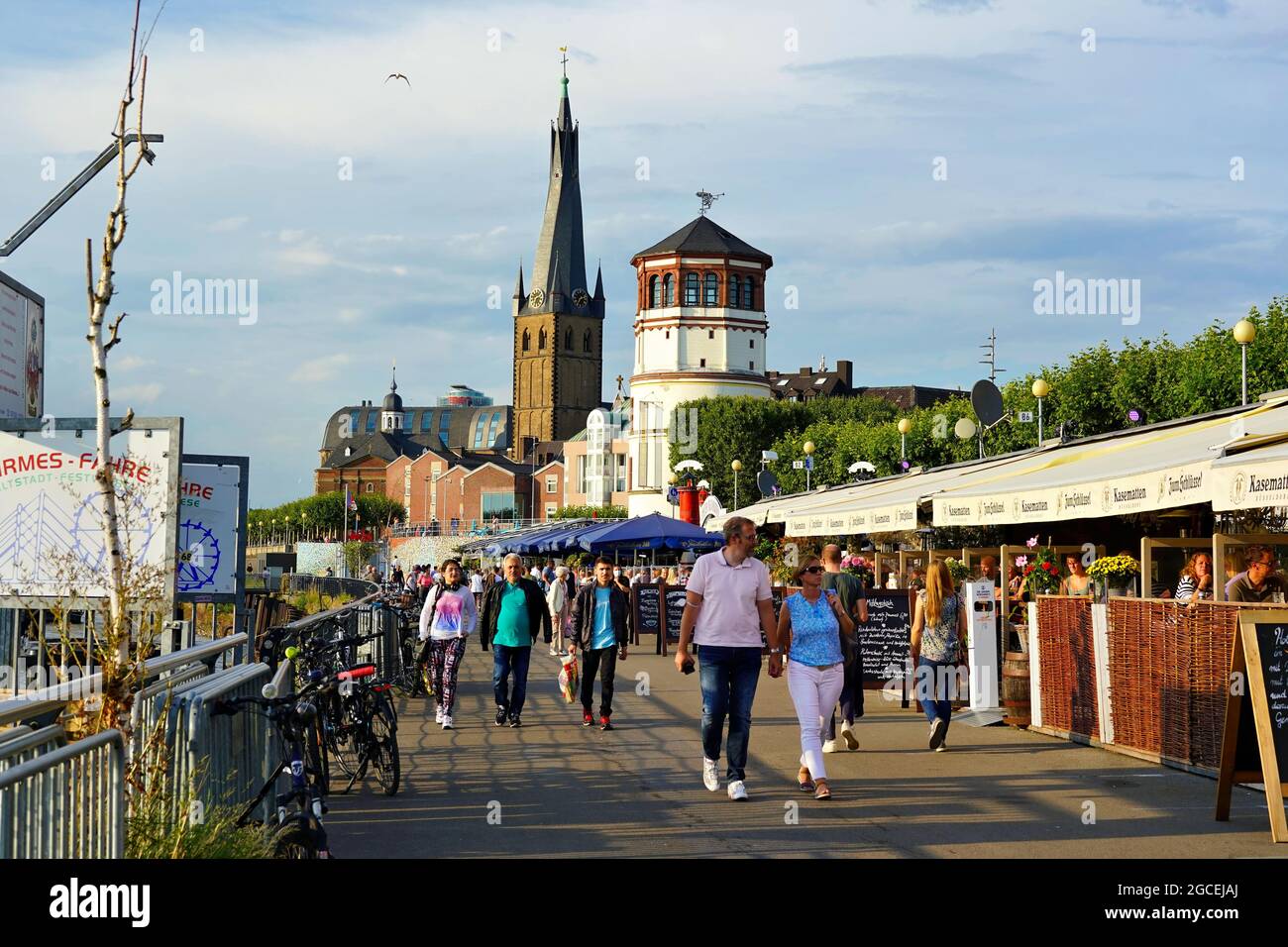 The popular tourist attraction Rhine river promenade with the two ...