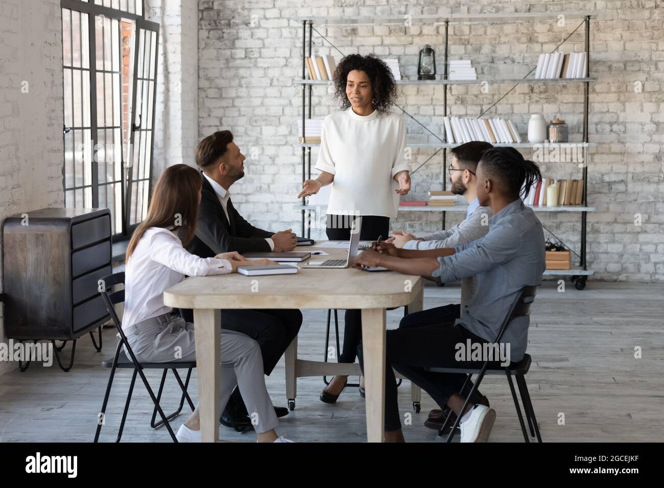 Successful African American female boss lead meeting with colleagues ...
