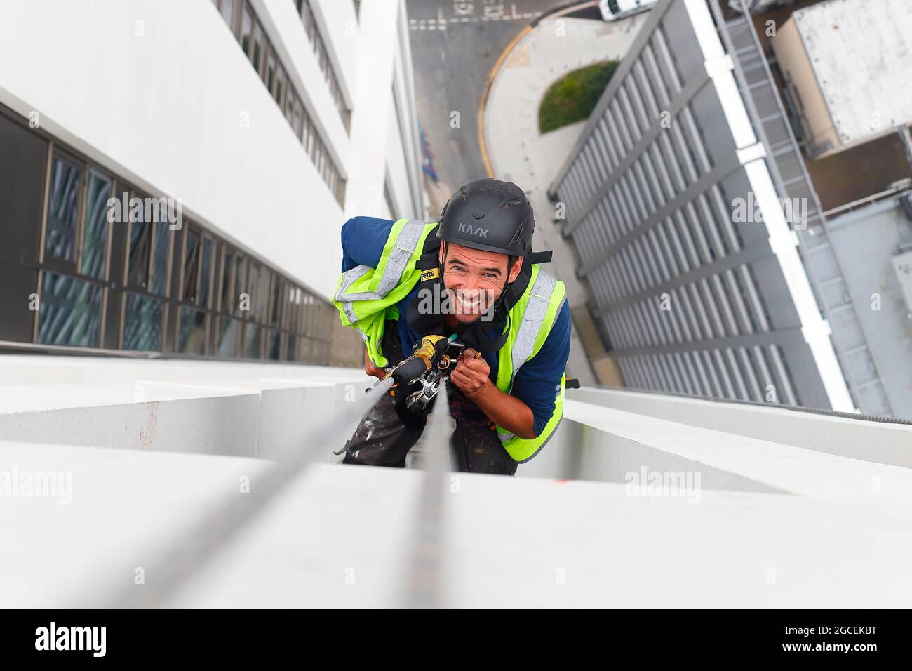 A construction worker, descends Altus House , which is Yorkshire's ...