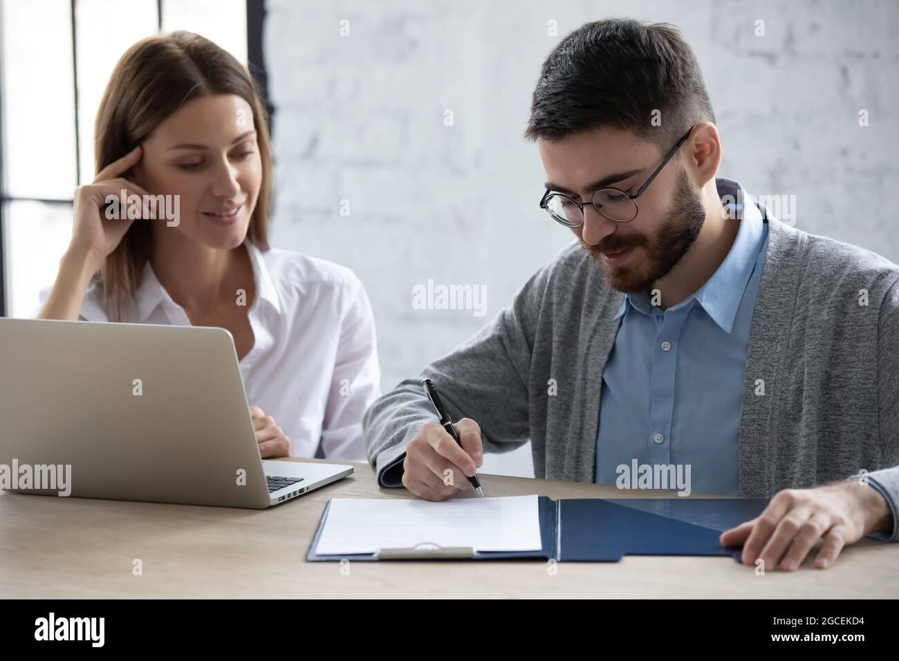 Male client sign document close deal with business partner Stock Photo ...