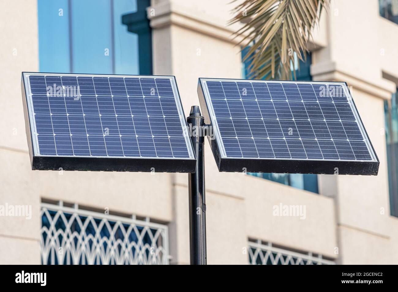 solar panel on the background of a residential building in Dubai. Green ...
