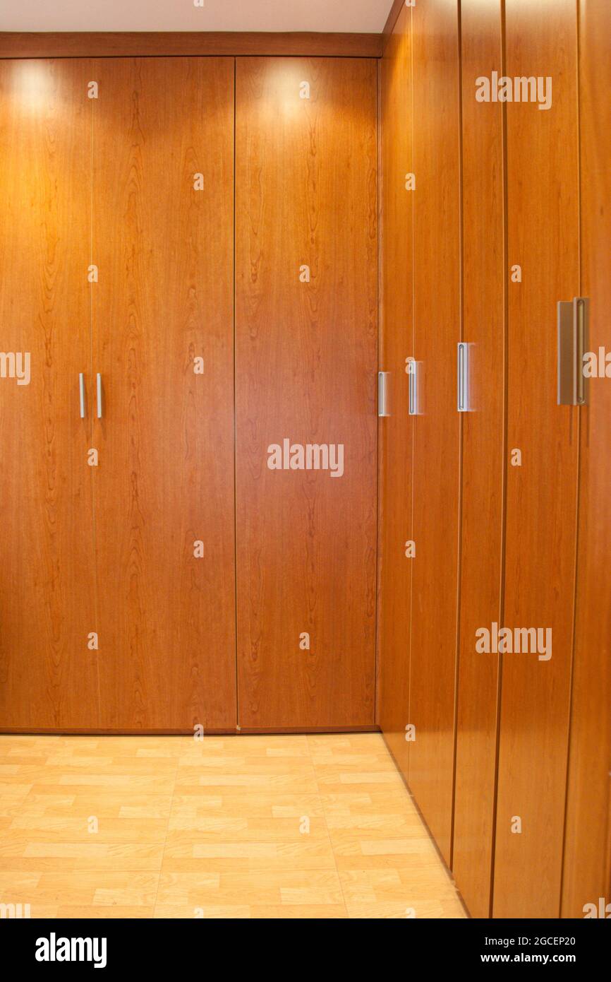 Wide wooden dressing room, interior of a modern house Stock Photo - Alamy