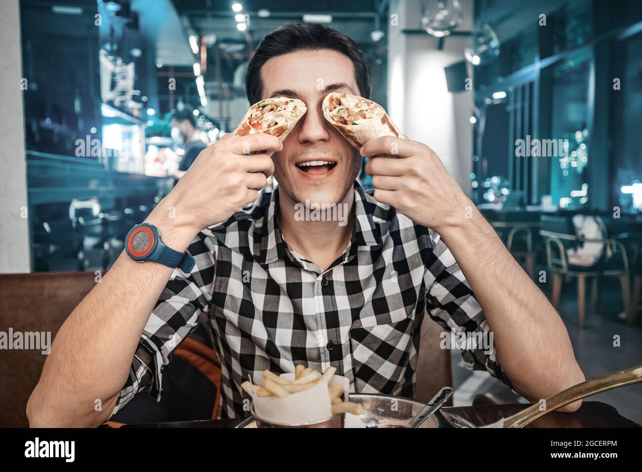 Funny caucasian man fooling around with Greek gyros and shawarma. Fast ...