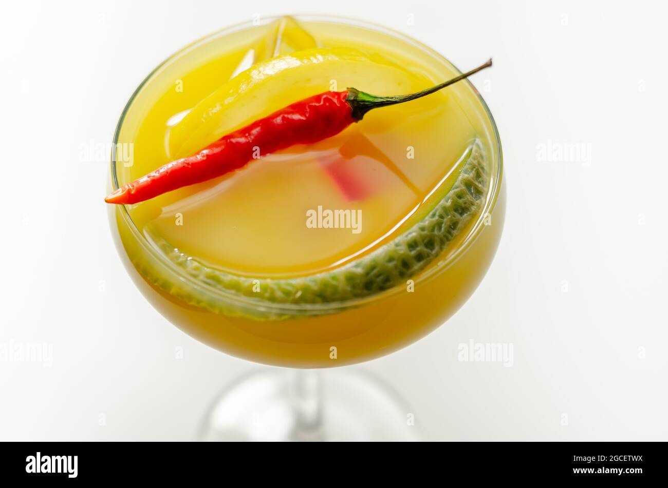 A holiday cocktail based on vodka, liqueur, fresh melon and red bird ...