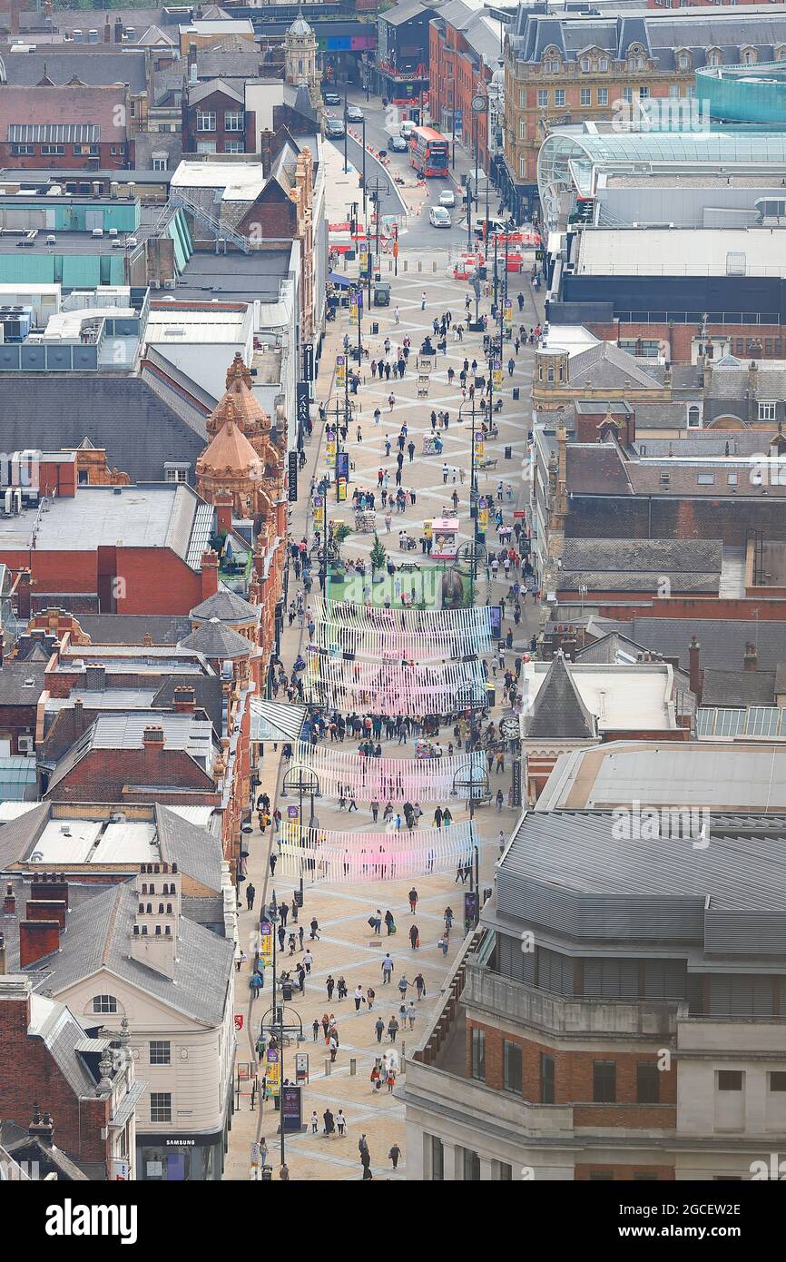 Looking down on Briggate in Leeds which is a pedestrianised shopping ...